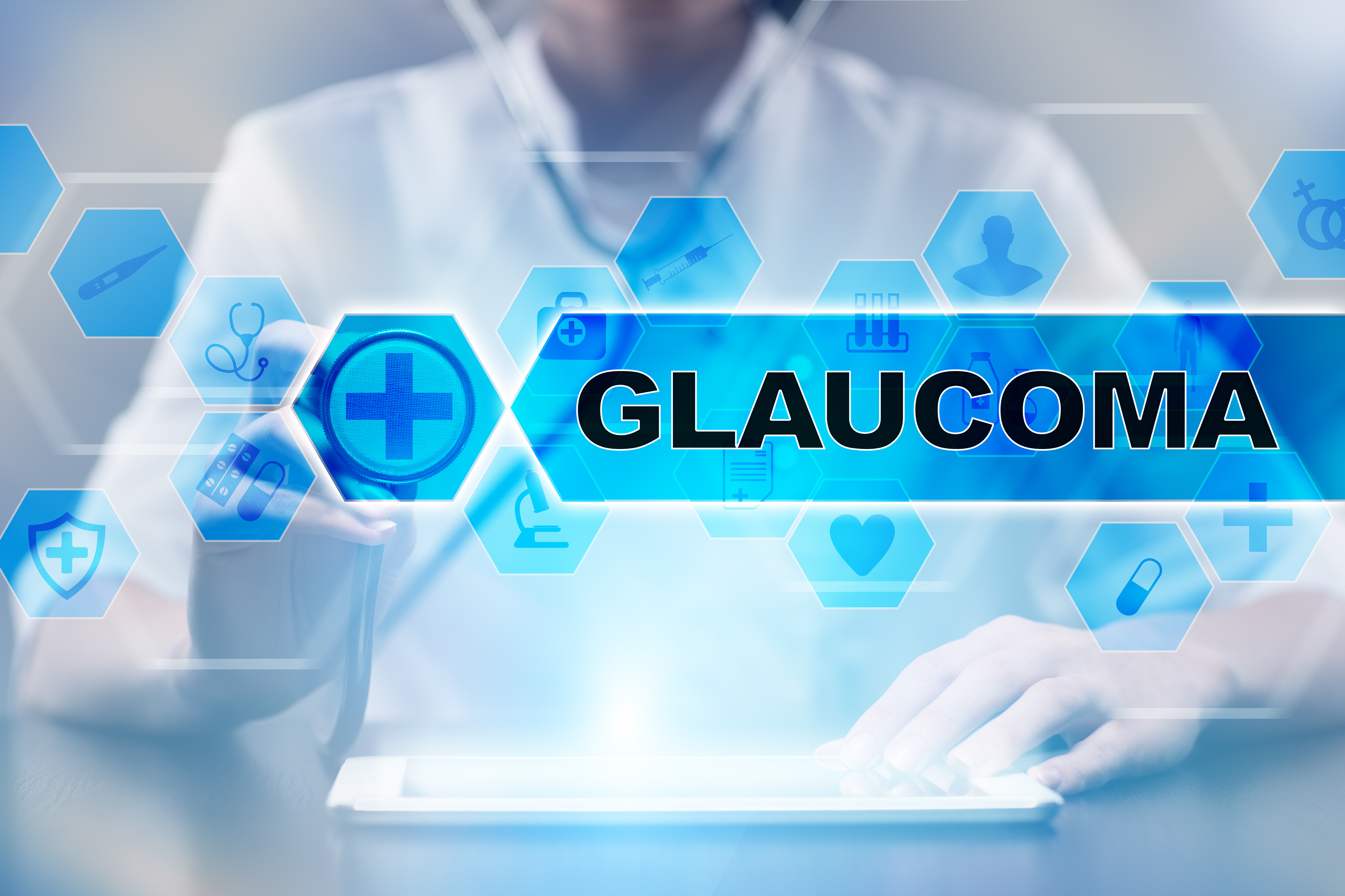 Medical doctor using tablet PC with glaucoma medical concept ...